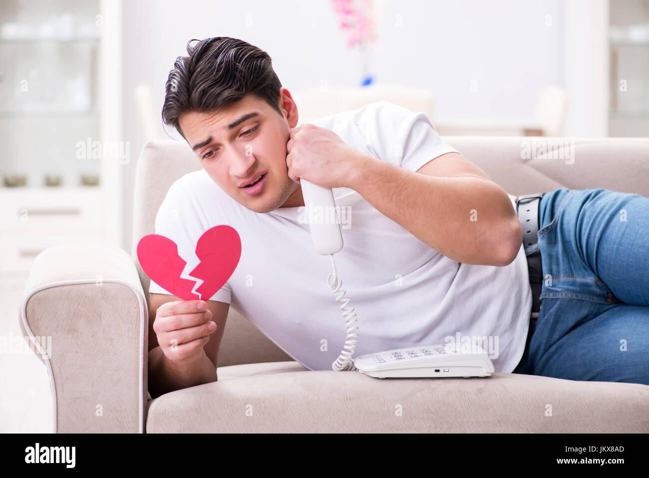 Young man in sad saint valentine concept Stock Photo - Alamy