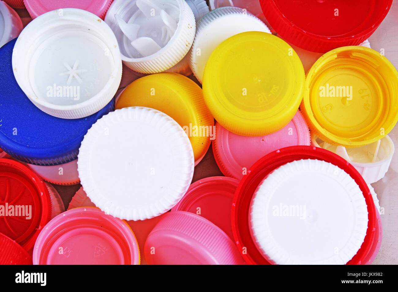 Collect plastic bottle caps. Close-up shot of stack of recyclable ...