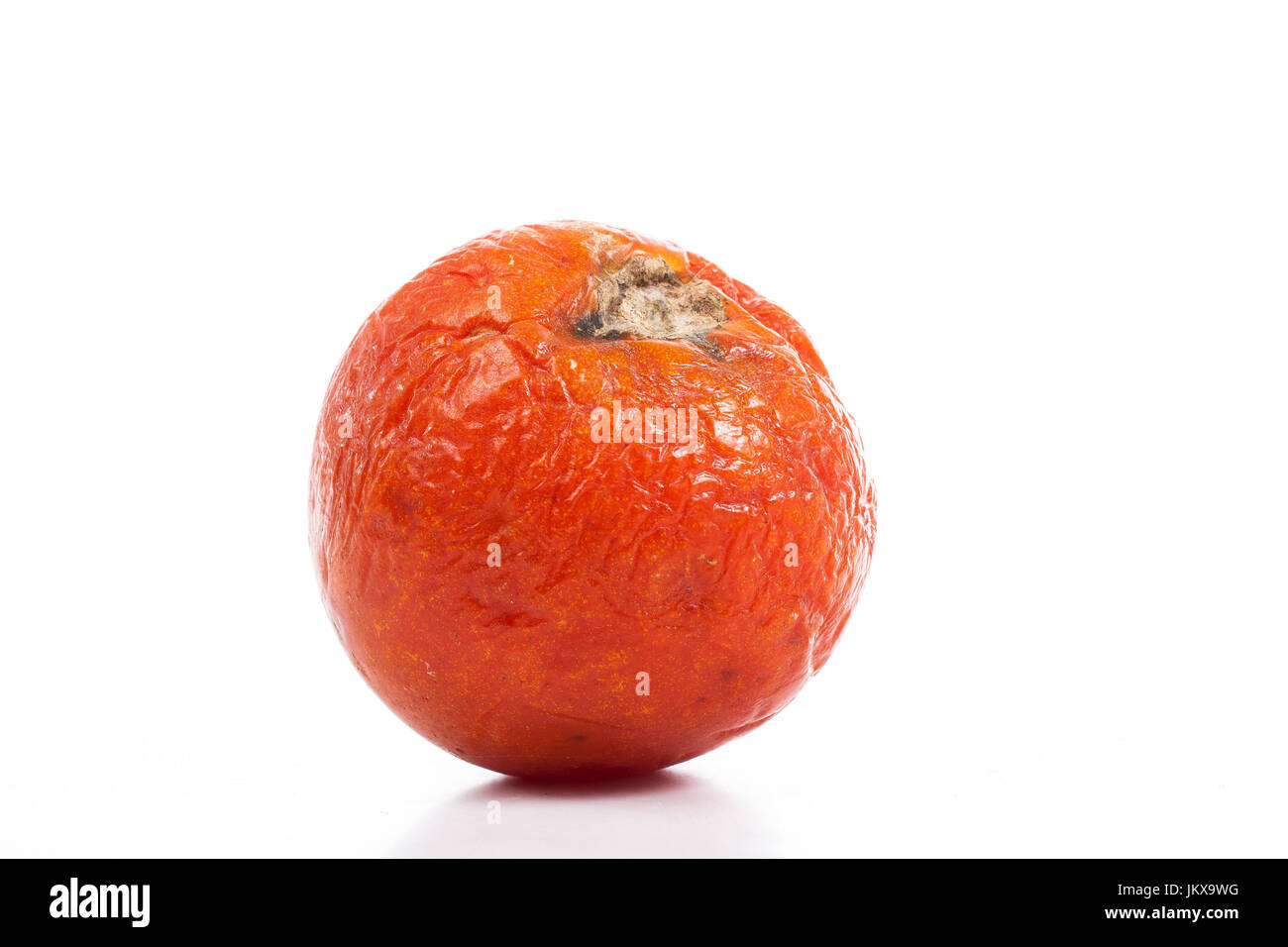 Old wrinkled dry tomato Stock Photo - Alamy