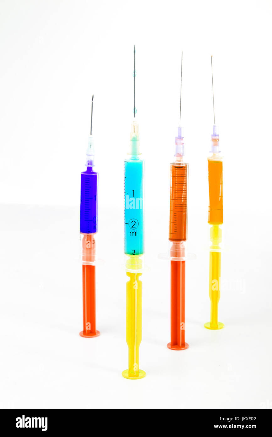 Syringes vaccination colorful injection tubes on isolated white studio ...