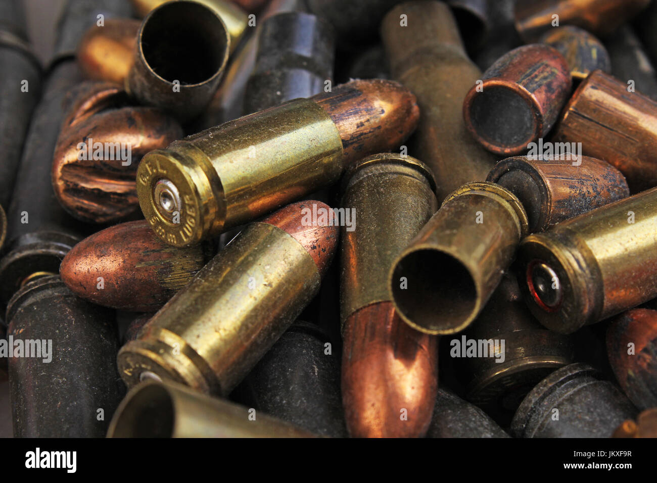 Heap of gun bullets. Weapon Cartridge case sleeve background texture, 7 ...