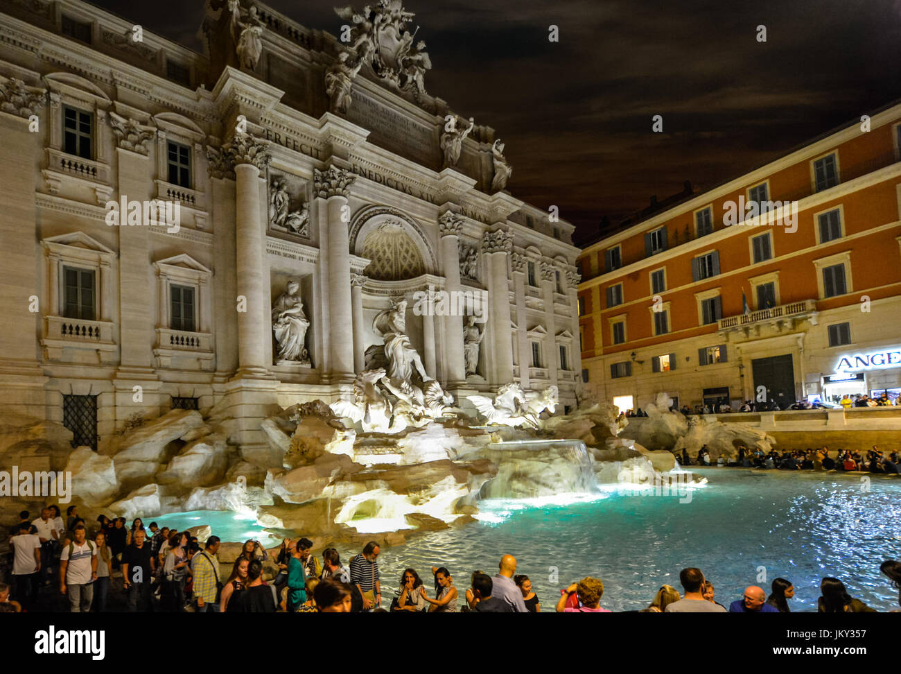 Warm summer night in Rome Italy as crowds of tourists enjoy the Trevi ...