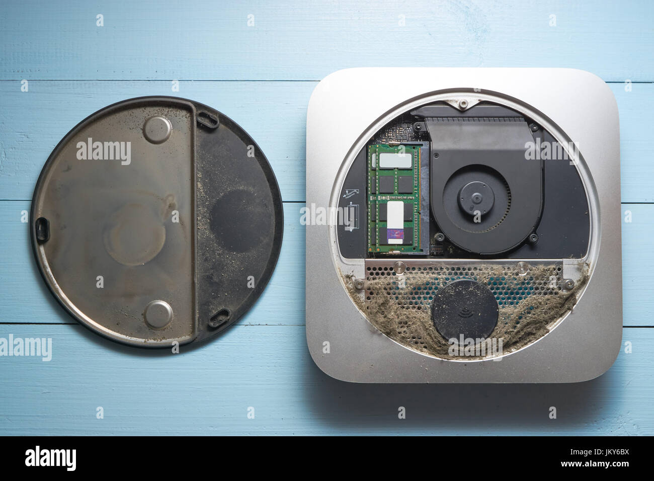 very dirty dusty office small personal computer with open cover aside ...