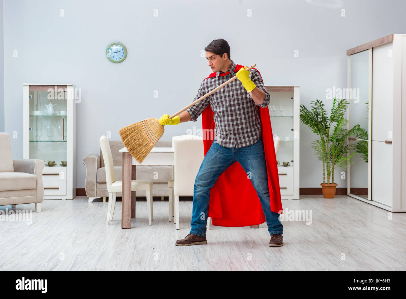 Super hero cleaner working at home Stock Photo - Alamy