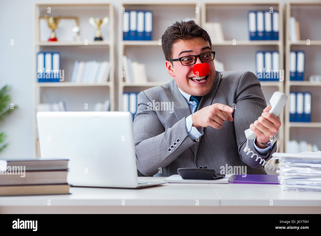 Clown businessman working in the office Stock Photo - Alamy