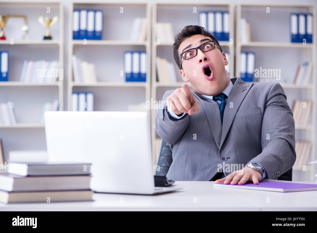 Funny businessman clown acting silly in the office Stock Photo - Alamy