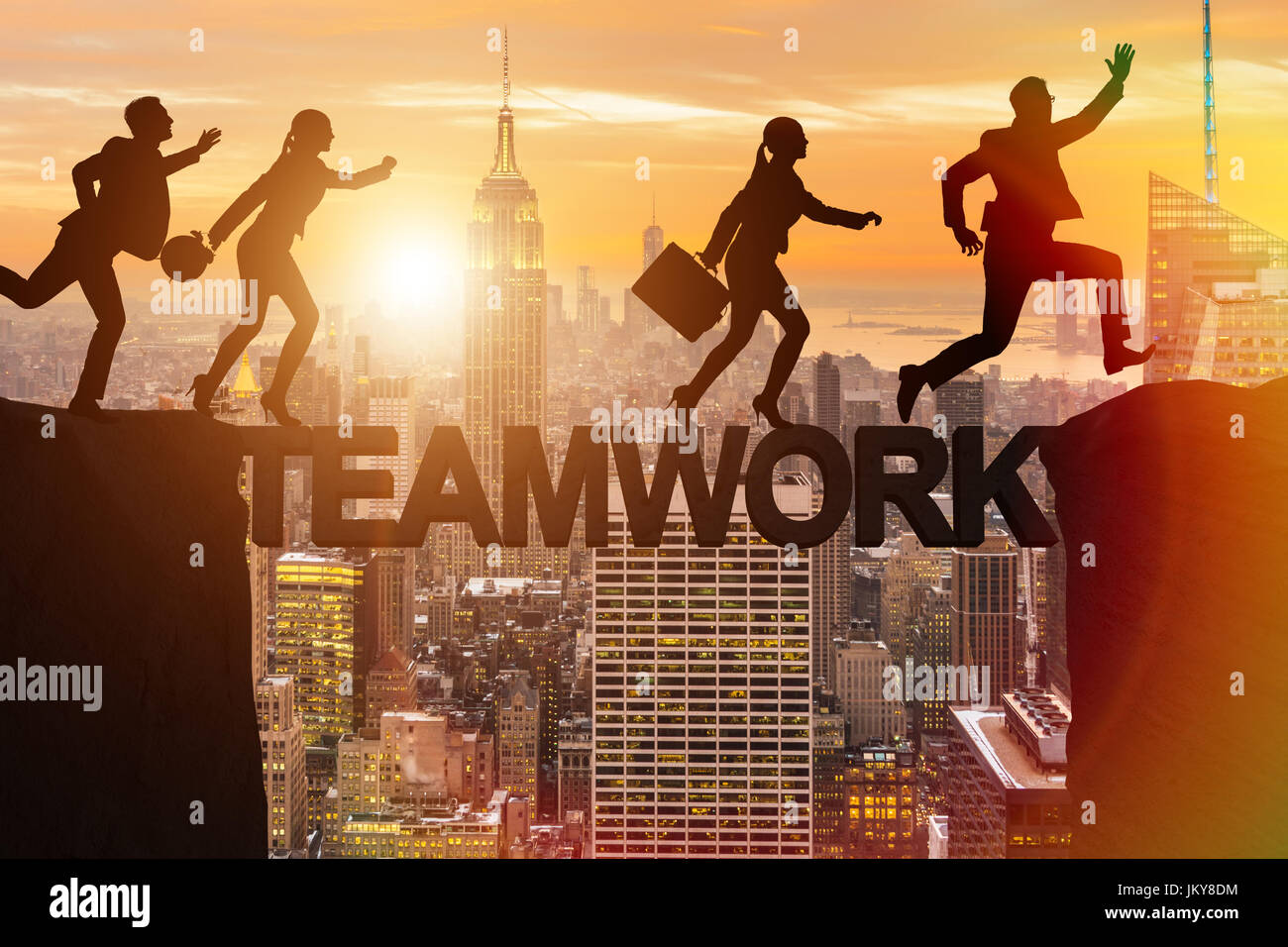 Teamwork concept with business people crossing bridge Stock Photo - Alamy