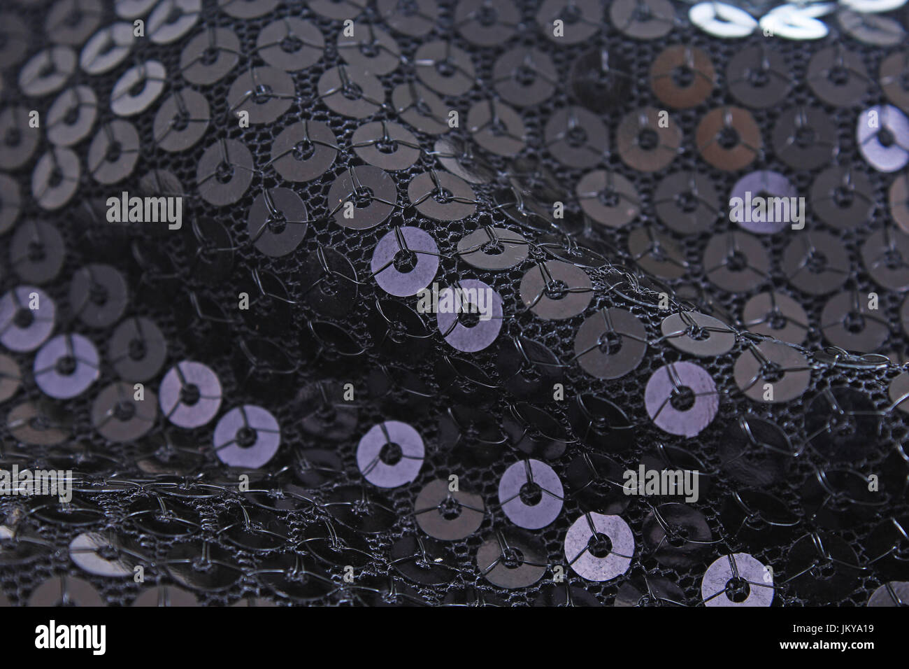 Black sequin texture. Black sequins as background Stock Photo - Alamy