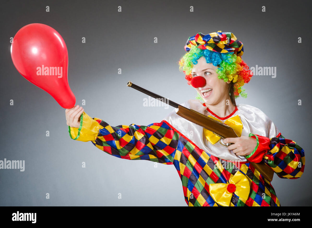 Funny clown in comical concept Stock Photo - Alamy