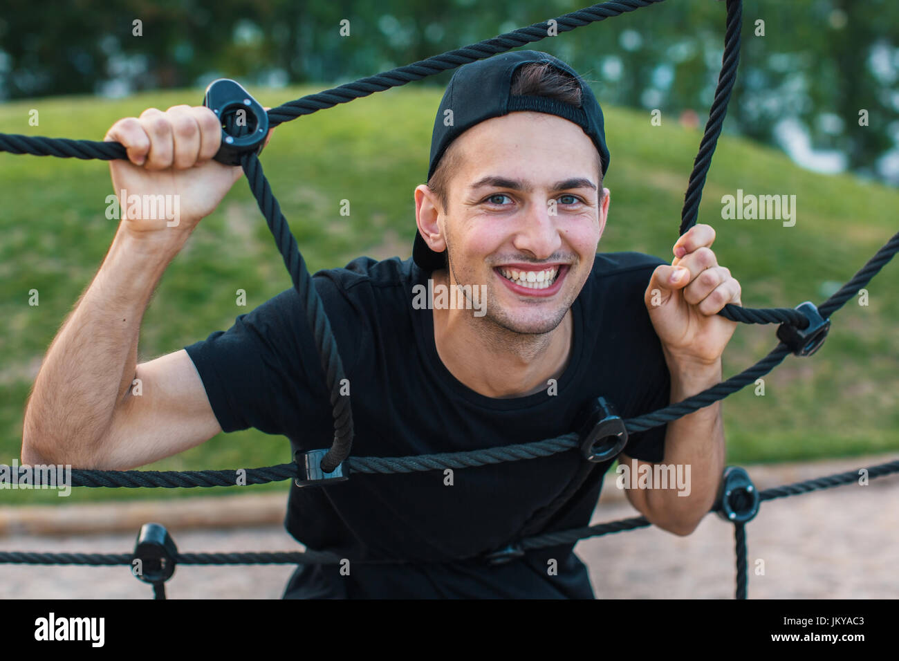 Portrait of funny guy. Handsome young man outdoors Stock Photo - Alamy