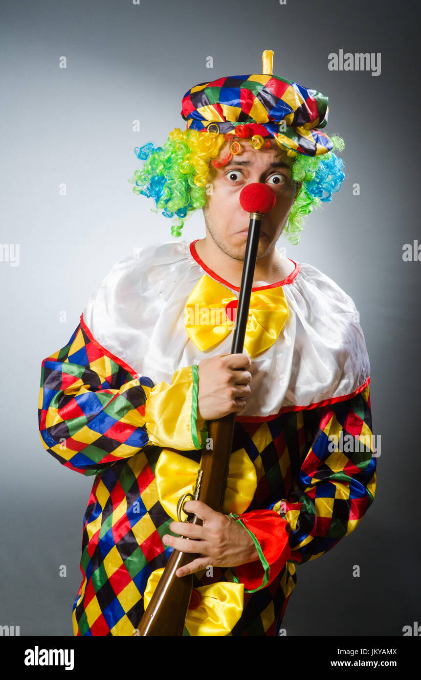 Funny clown in comical concept Stock Photo - Alamy