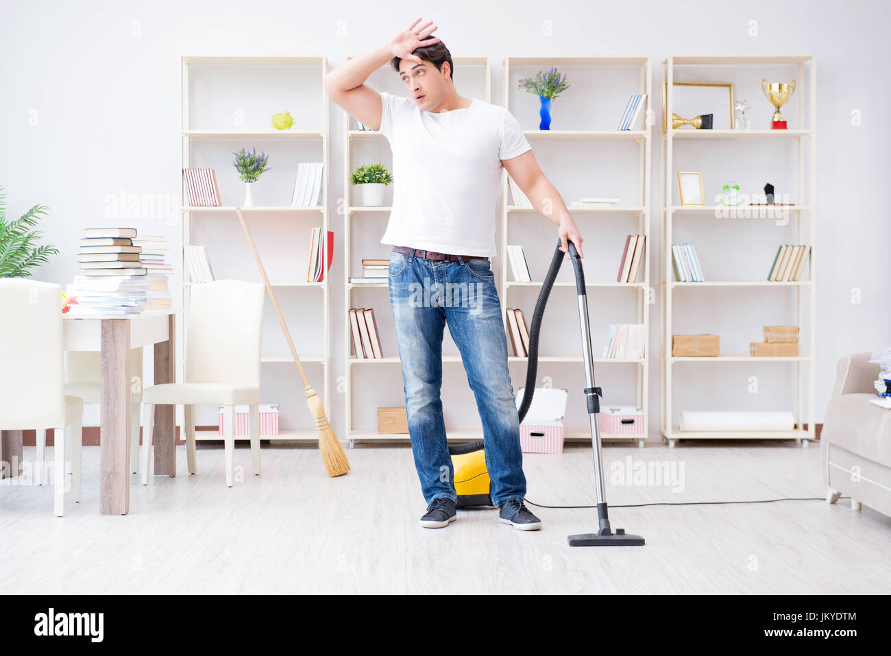 Man doing cleaning at home Stock Photo - Alamy