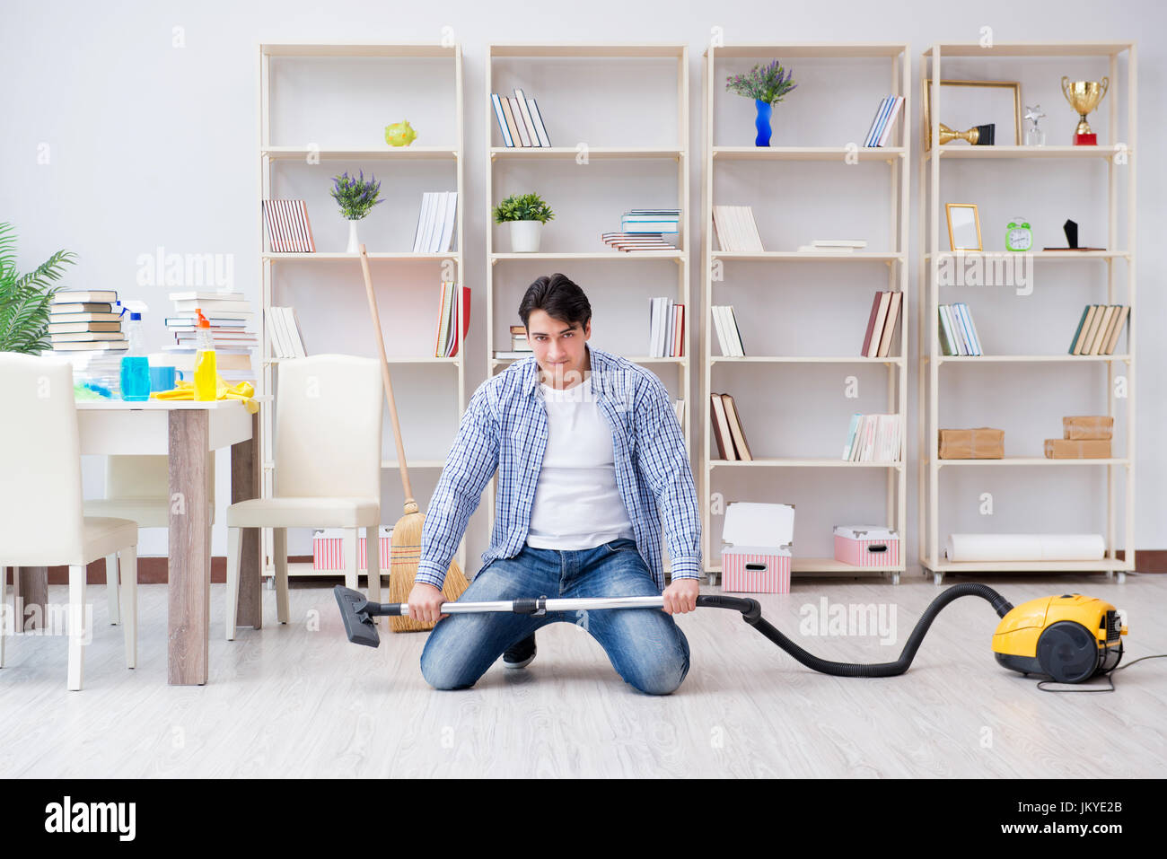 Man doing cleaning at home Stock Photo - Alamy