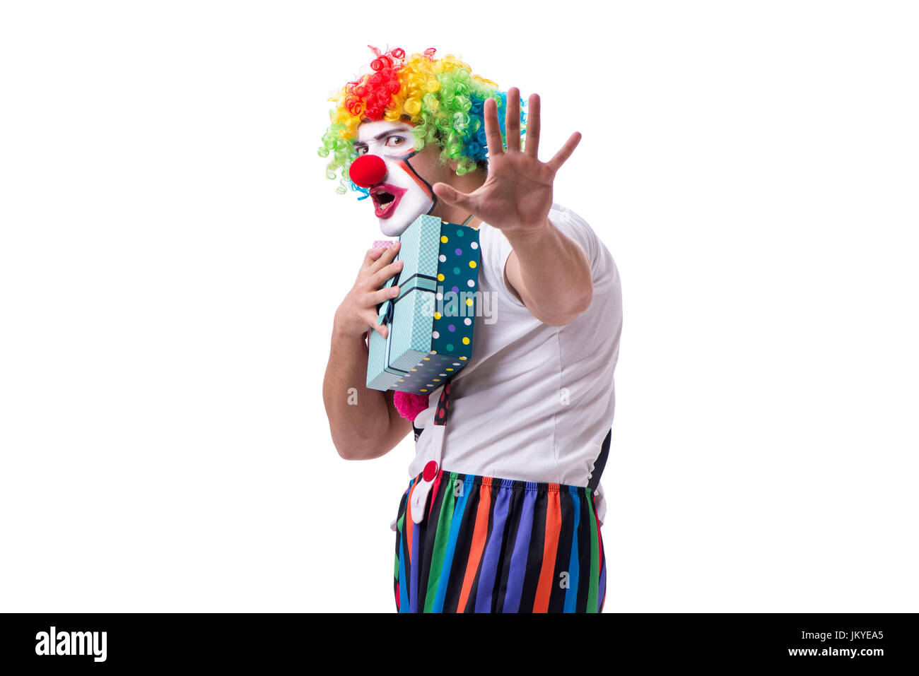Funny clown with a gift present box isolated on white background Stock ...