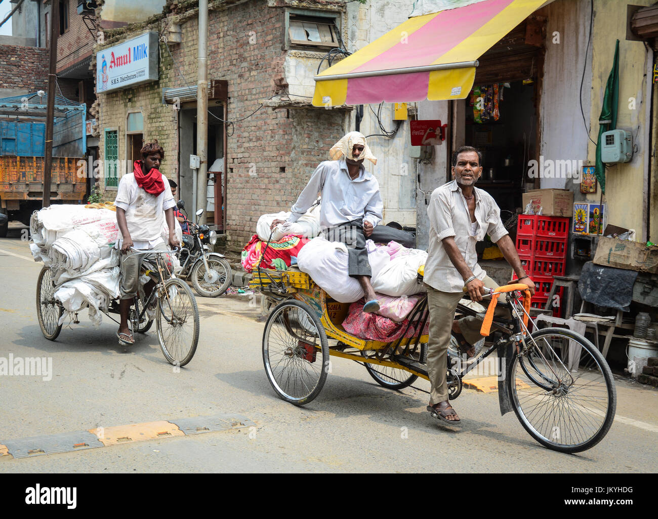 Amritsar, India - Jul 25, 2015. Men riding rickshaw in Amritsar, India ...
