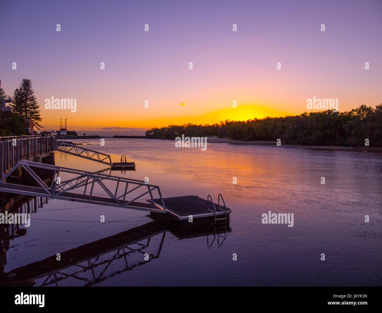 Sunrise Sky Reflection of Jetty by the River Mouth at Low Tide in the ...
