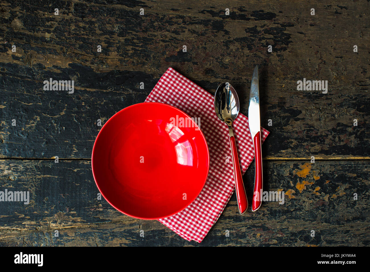 Rustic table setting with vintage bowls and silverware on dark old ...