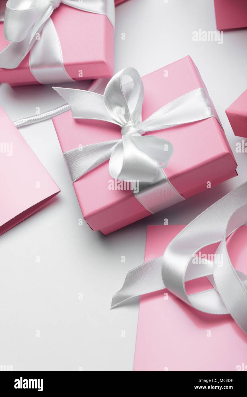 Luxury boxes tied with a white ribbon Stock Photo - Alamy