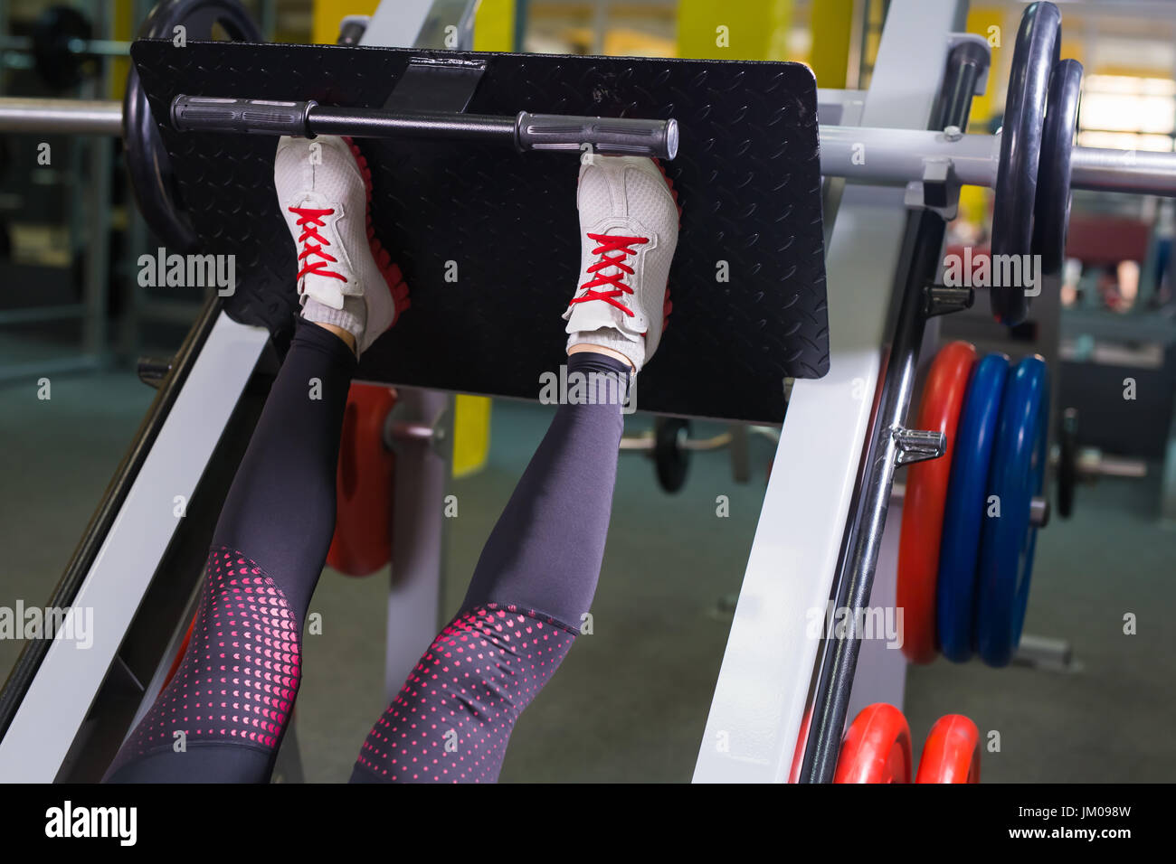 Sport, training, gym and people concept - Side view of a fit young ...