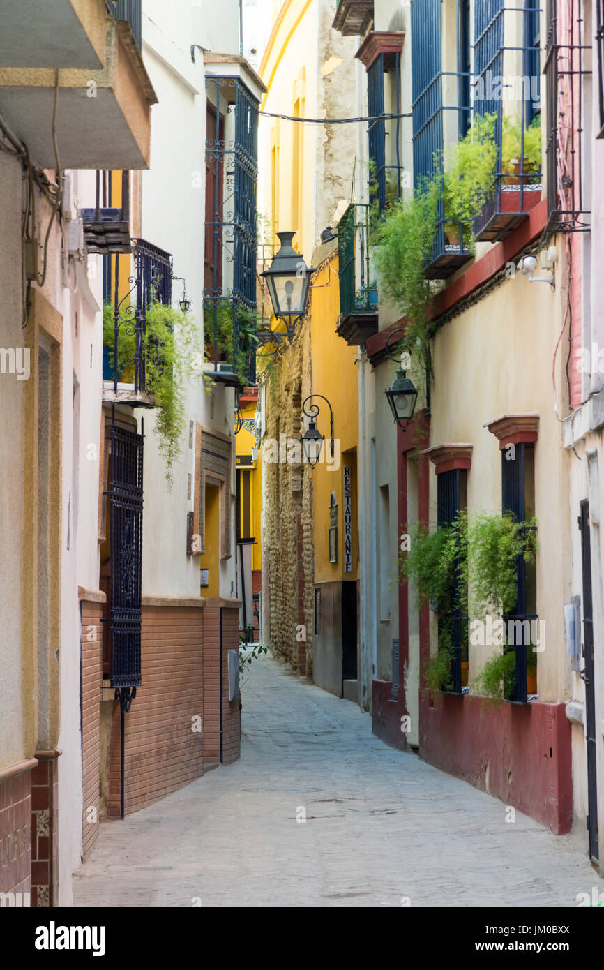 Street in Seville old city Stock Photo - Alamy