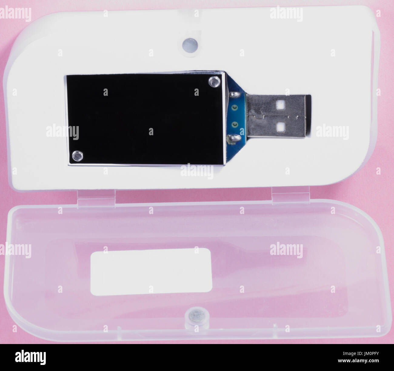 electronic device in plastic case on pink background at day Stock Photo ...