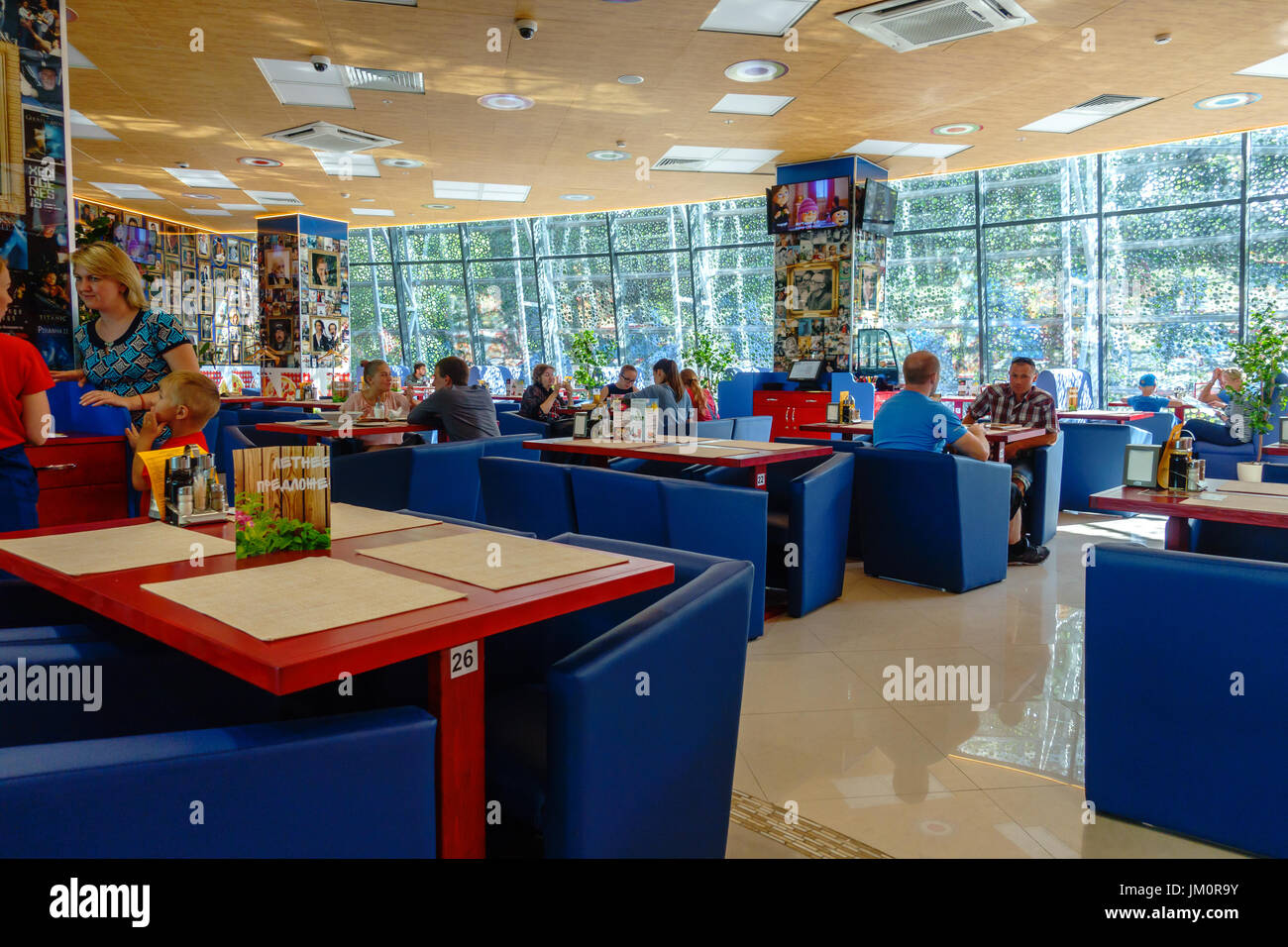 People eating in modern cafe at day time Stock Photo - Alamy