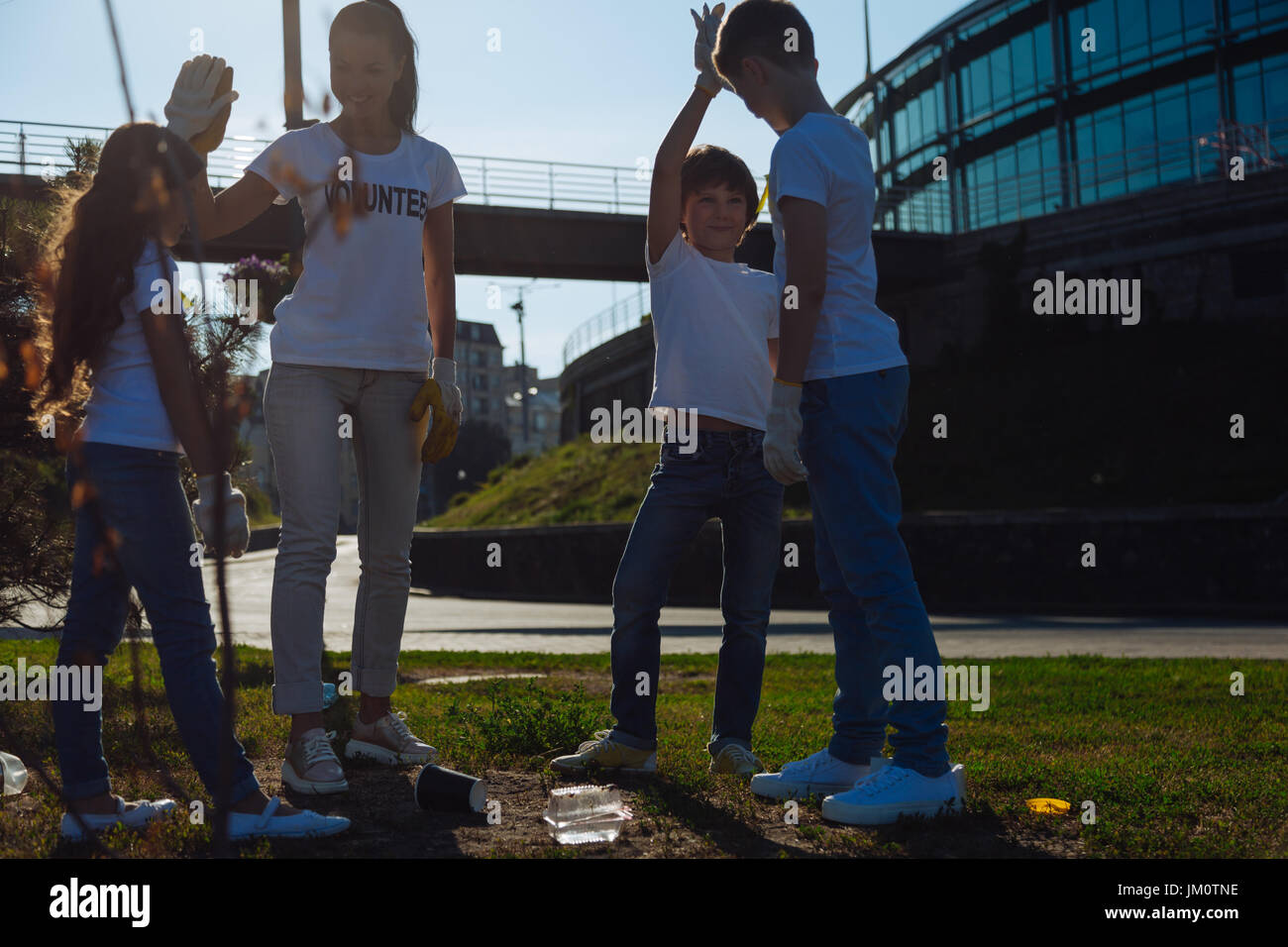 Merciful girls smiling after cleaning Stock Photo - Alamy