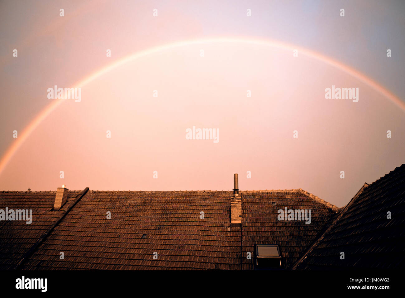 beautiful rainbow in the evening Stock Photo - Alamy