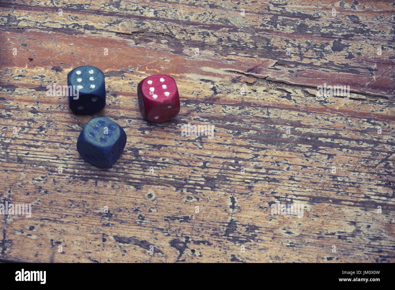 vintage three dices with triple six on the wood floor Stock Photo - Alamy
