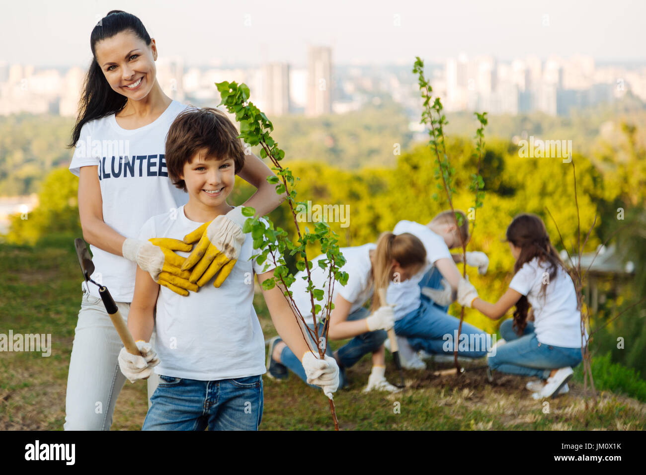 Woman volunteering with kids hi-res stock photography and images - Alamy