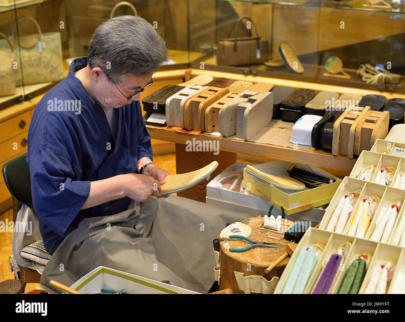 KYOTO, JAPAN - July 24, 2017: A craftsman makes zori--traditional ...