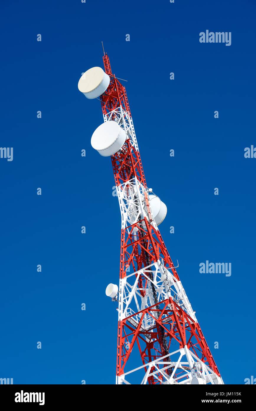 Telecommunications tower with clear blue sky Stock Photo - Alamy