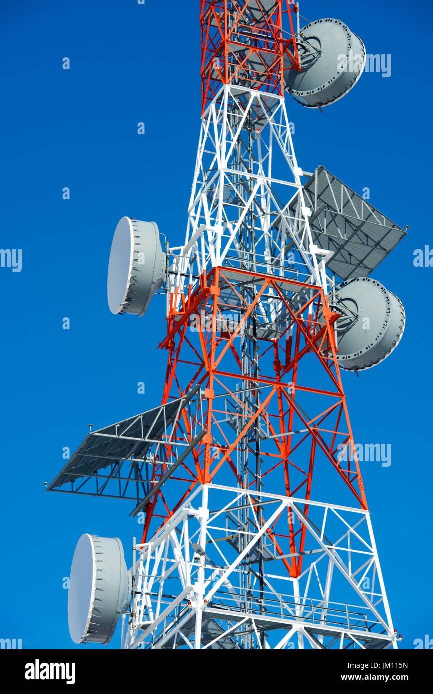Telecommunications tower with clear blue sky Stock Photo - Alamy