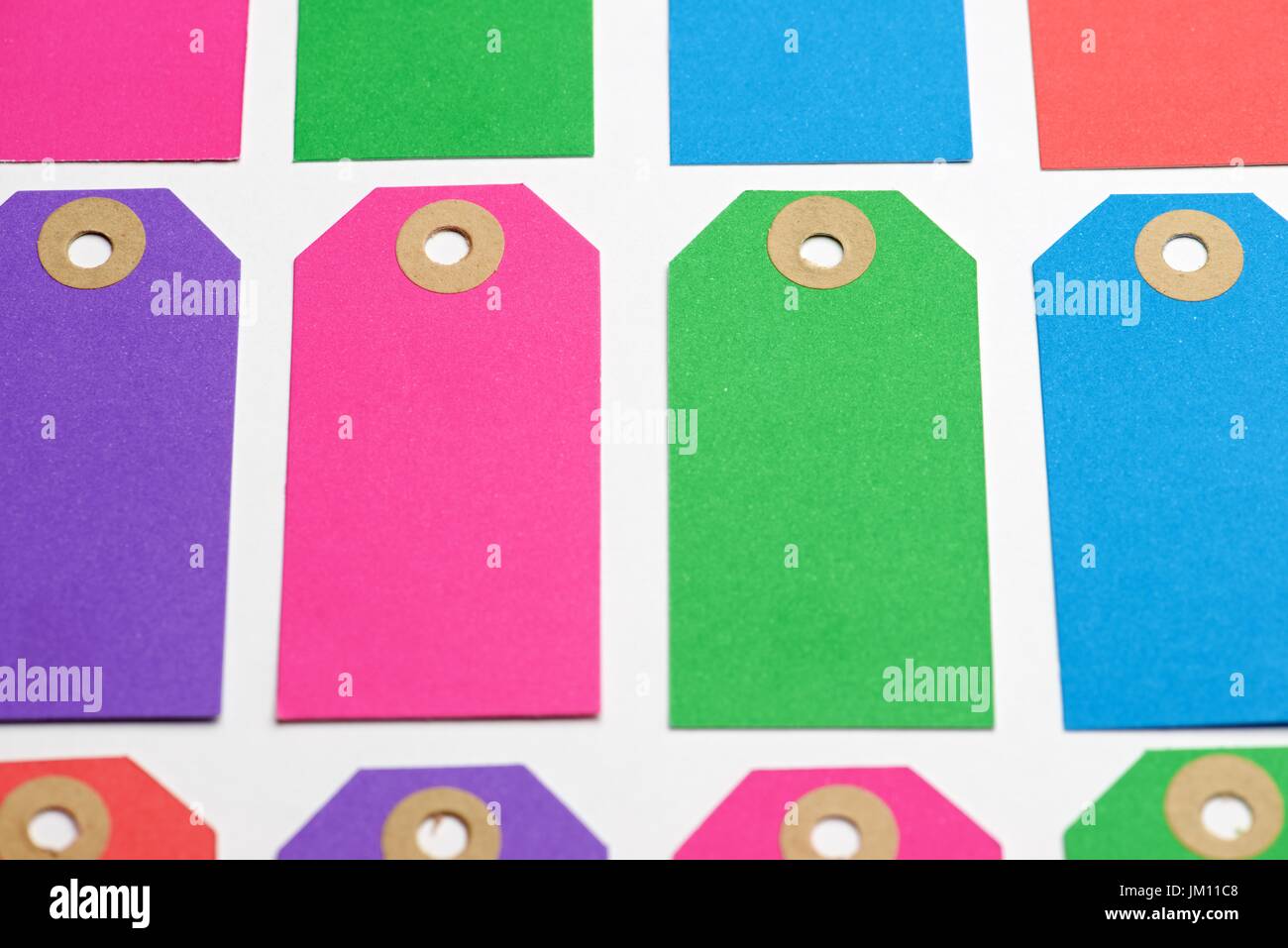 Labels group on a white table Stock Photo - Alamy