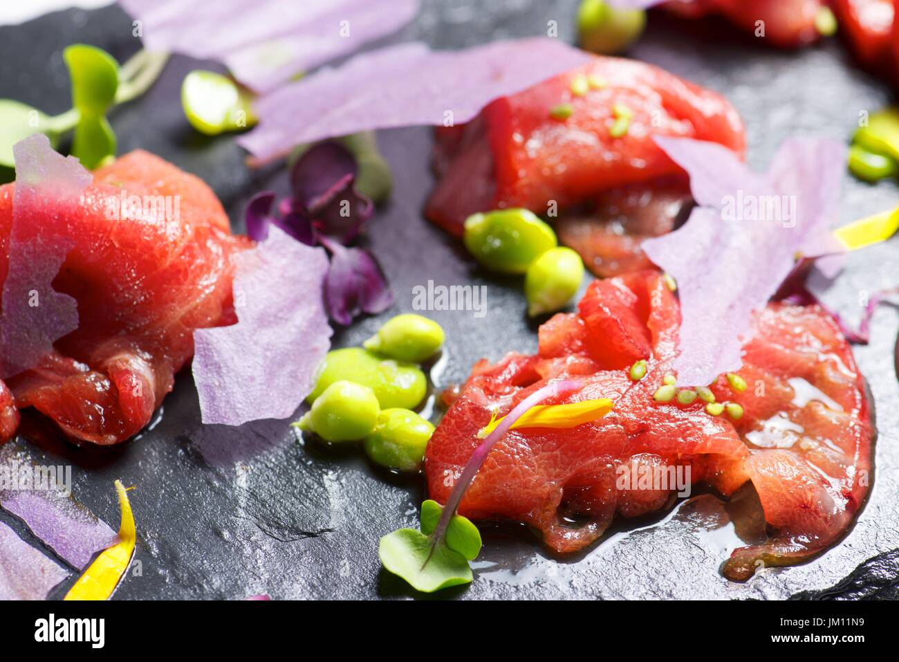 Red tuna sashimi on a slate plate Stock Photo - Alamy
