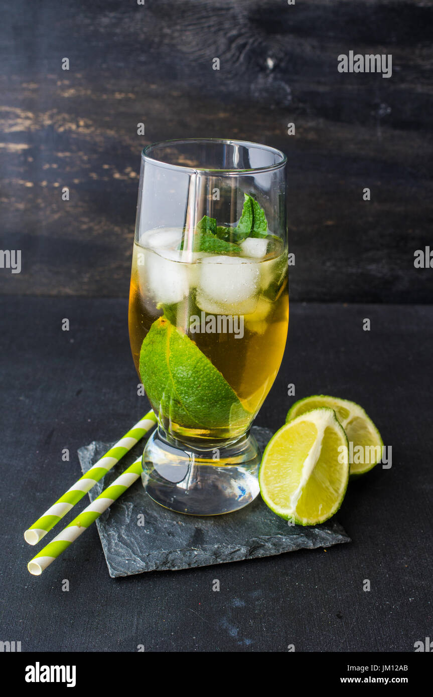 Summer drink glass of water with ice on dark background Stock Photo - Alamy