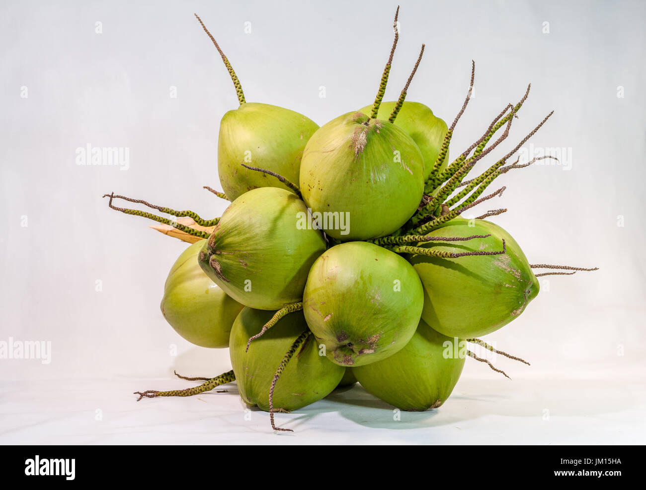 green coconut bunch on whire background Stock Photo - Alamy