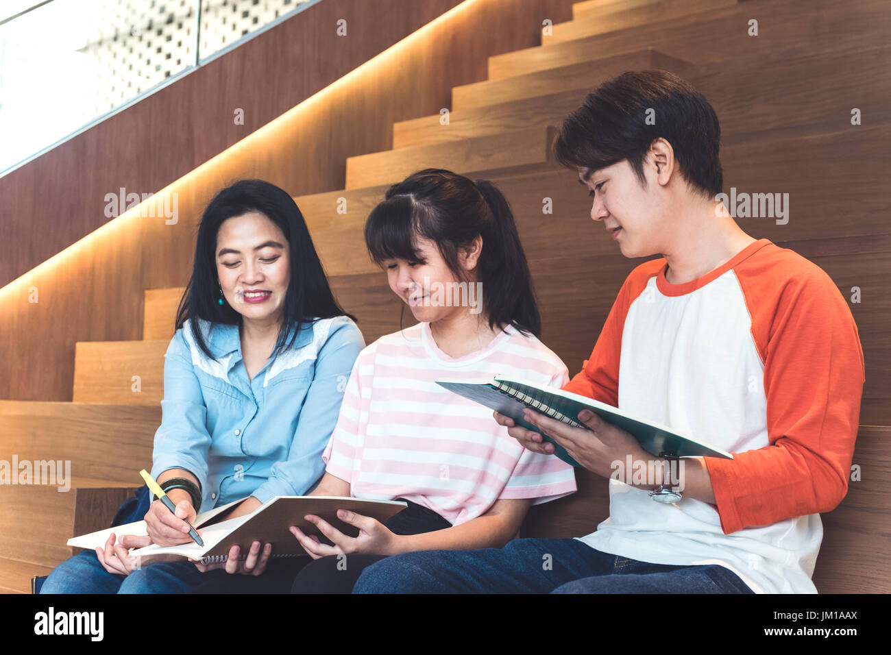 Male student sitting stair hi-res stock photography and images - Alamy