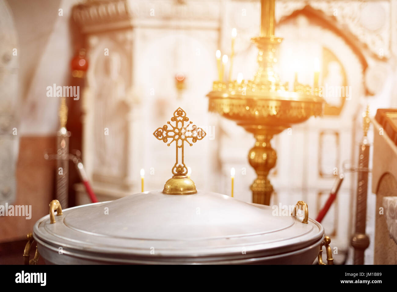 Orthodox christian church interior. Cross and candles during worship ...