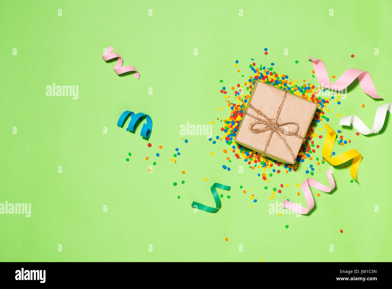Celebration Flat lay. Gift box with colorful party items on green ...