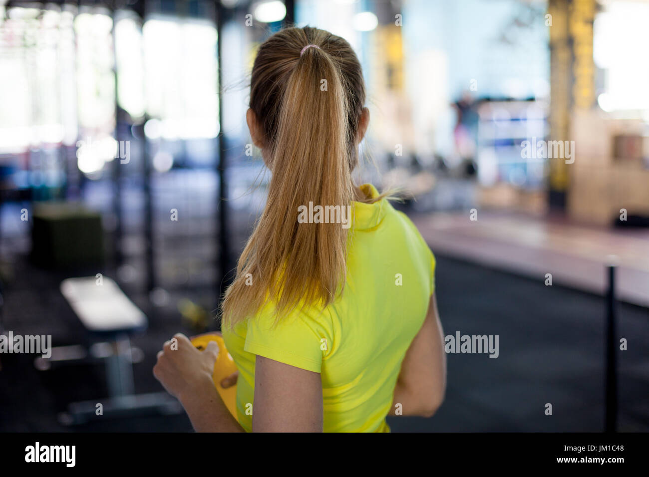 Start workout, back view. Shaker sports nutrition in the hands Stock ...