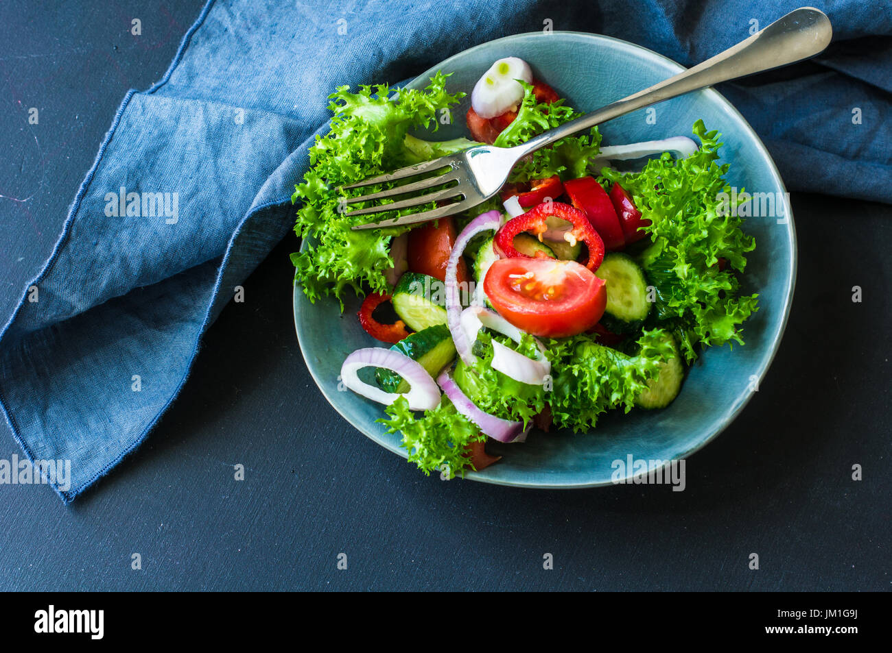 Summer organic salad with fresh vegetables on rustic plate Stock Photo ...