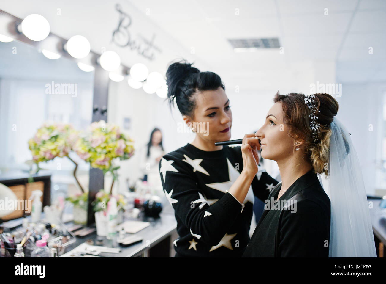 Having makeup done hi-res stock photography and images - Alamy