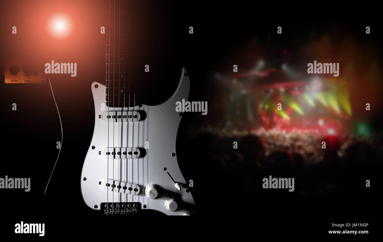 :Electric guitar in a theater during the concert. Low key image. Empty ...