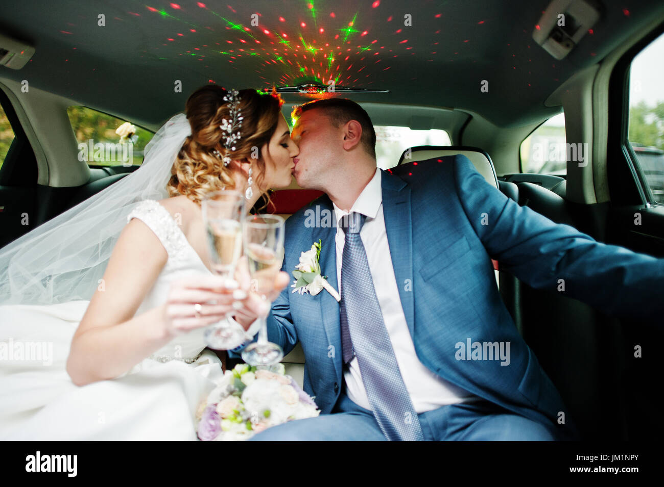 Couple celebrating limousine hi-res stock photography and images - Alamy