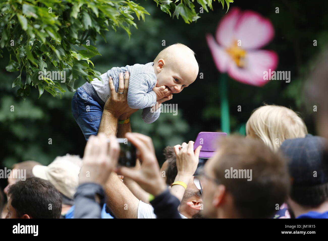 Happy family with baby outside hi-res stock photography and images - Alamy