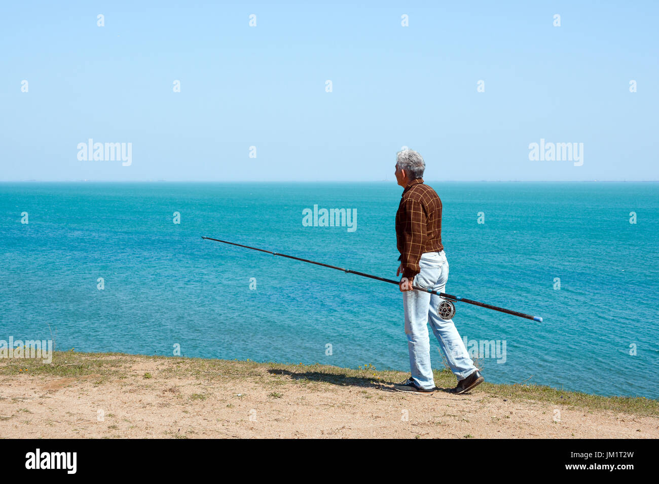 Fisherman on the sea Stock Photo - Alamy