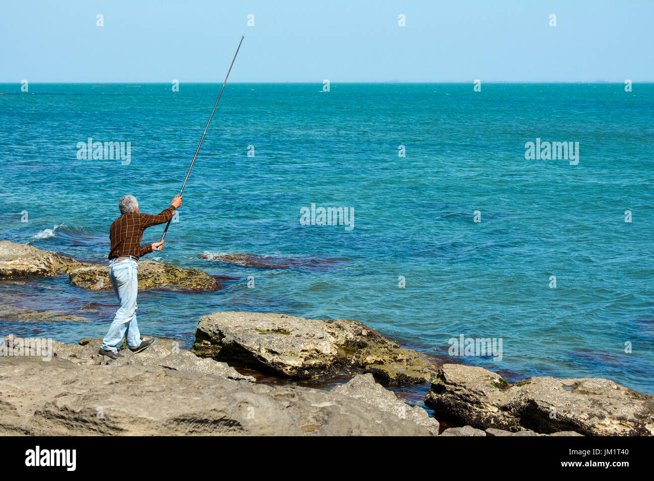Fisherman on the sea Stock Photo - Alamy