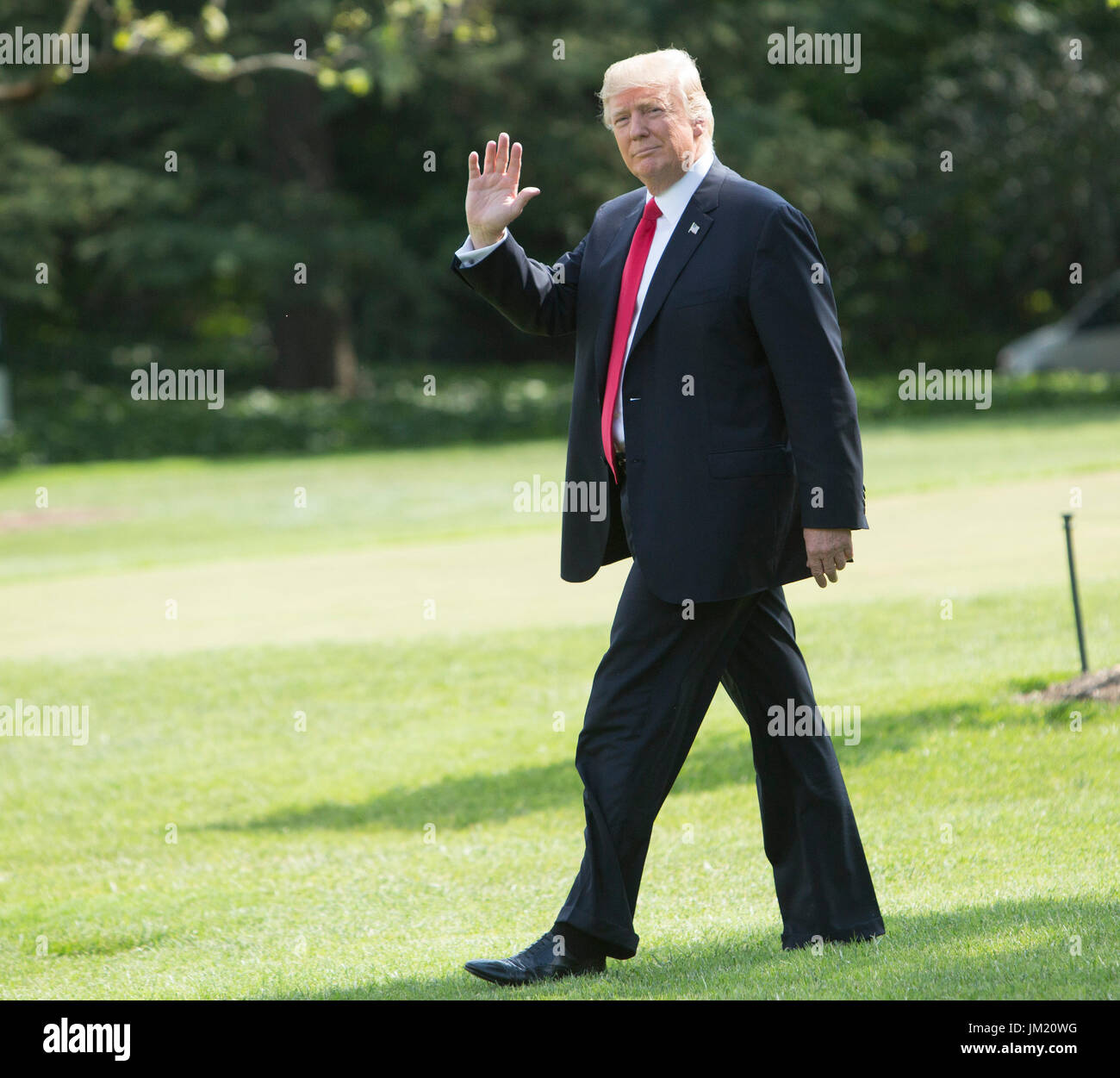 United States President Donald J. Trump waves as he departs The White ...