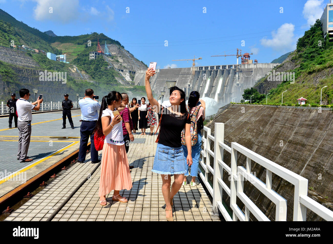 Tian'e. 26th July, 2017. Tourists take pictures at the Longtan ...